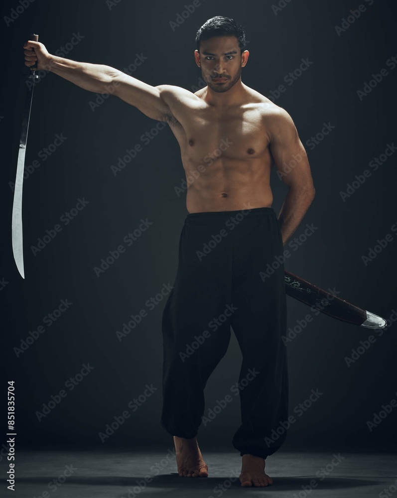Portrait, samurai sword and Asian man in studio for training, exercise ...