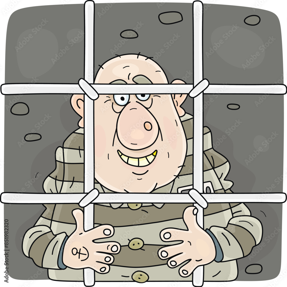 Sad prisoner in a striped uniform sitting with a sour face behind bars ...