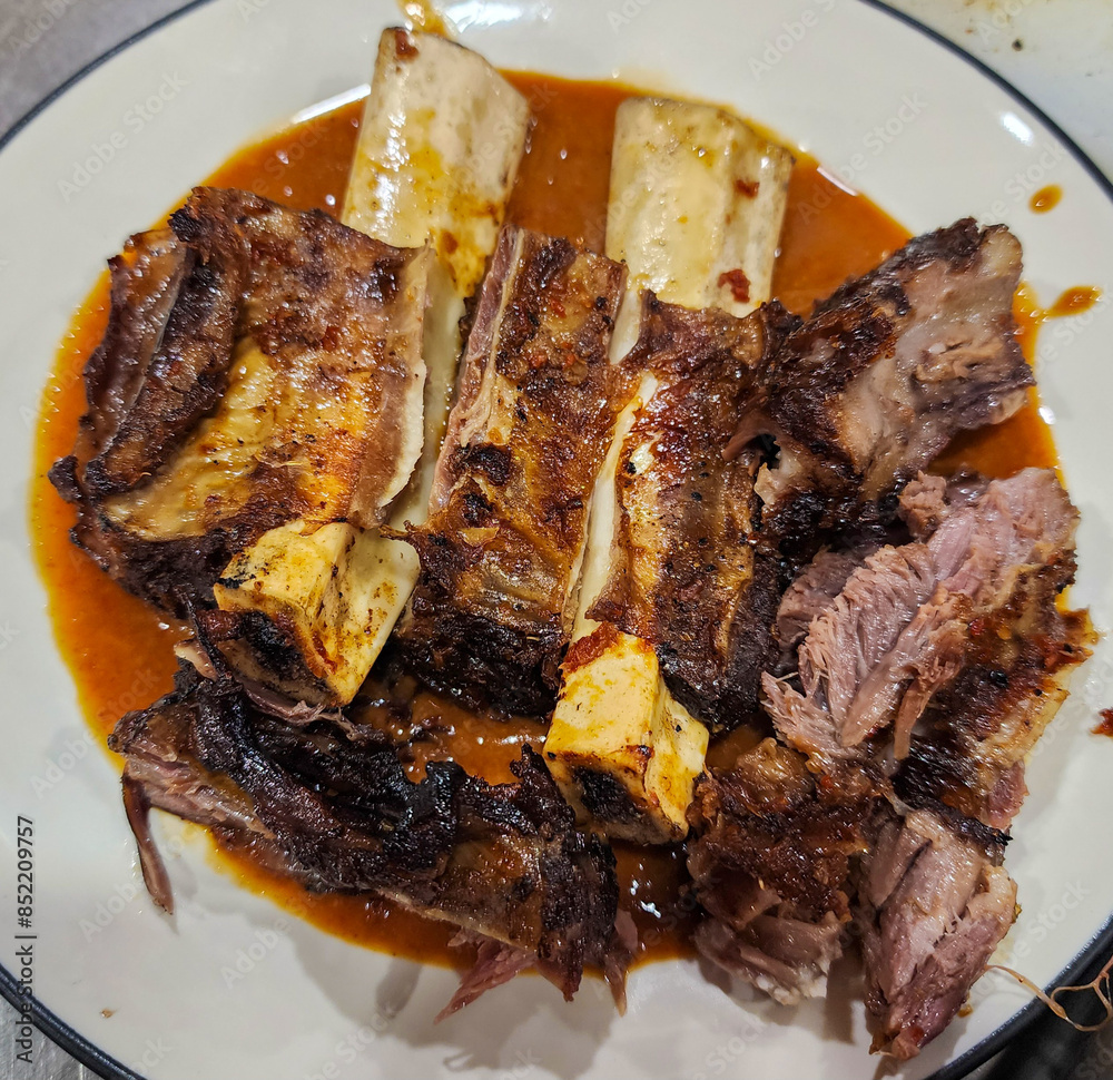 Indonesian traditional food named " sop konro iga sapi bakar bumbu ...