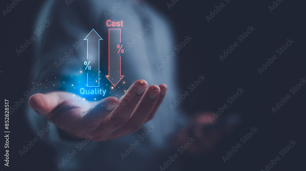 Quality control concept: A businessman holds symbols showing an upward ...