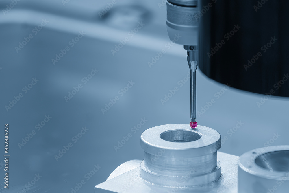 The CMM probe measuring the mold parts in the light blue scene. Stock ...