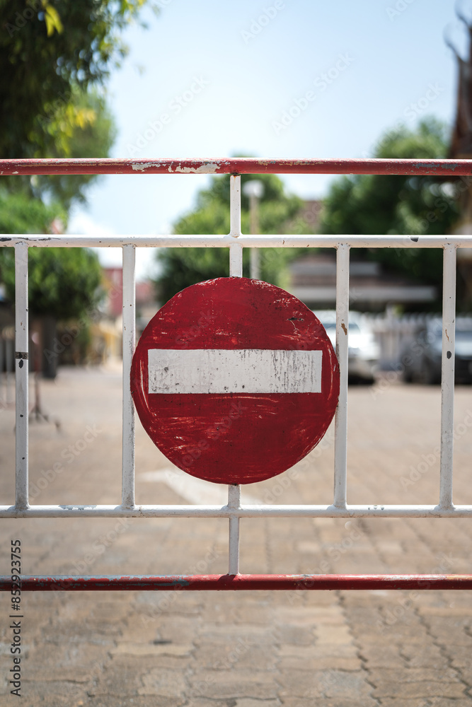 "Do not enter" or "One way" traffic road sign on road barrier fence ...
