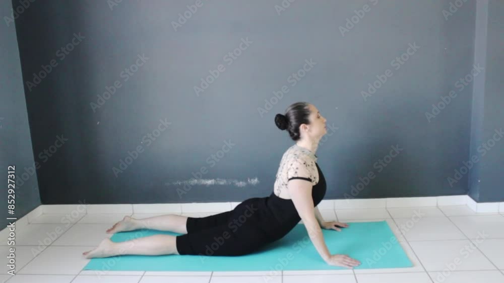 Female fitness instructor teaching yoga posture. Woman performing the ...