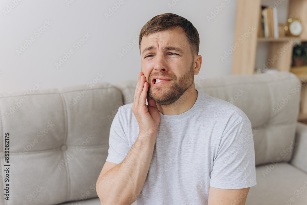 Dental health problems concept. Man suffering from strong toothache ...