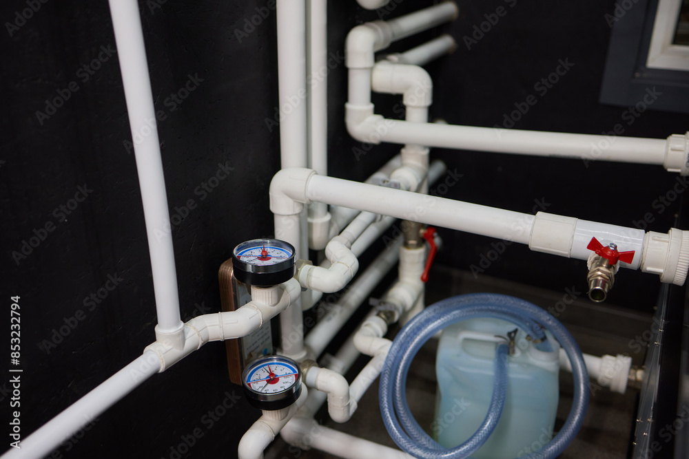 Modern plumbing system with gauges and water pipes for measuring ...