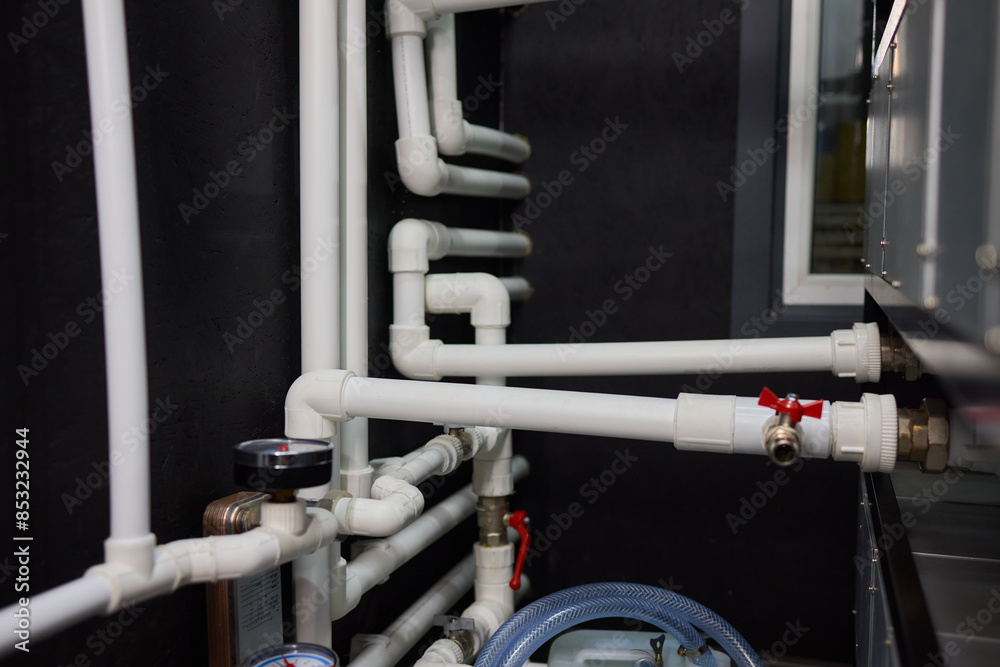 Modern plumbing system with gauges and water pipes for measuring ...