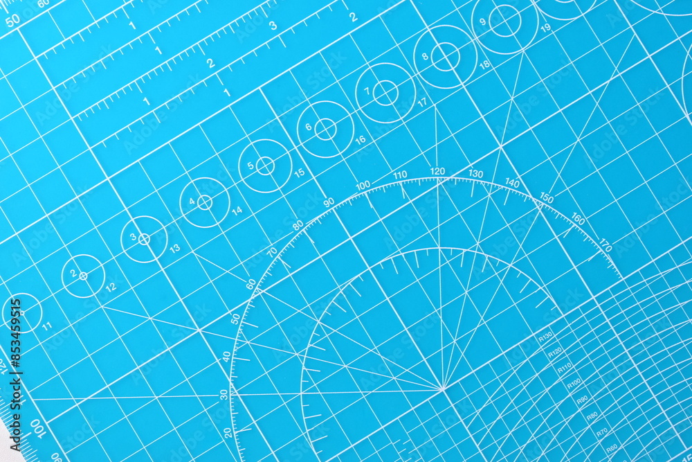 blue cutting mat board background with line and scale measure guide ...