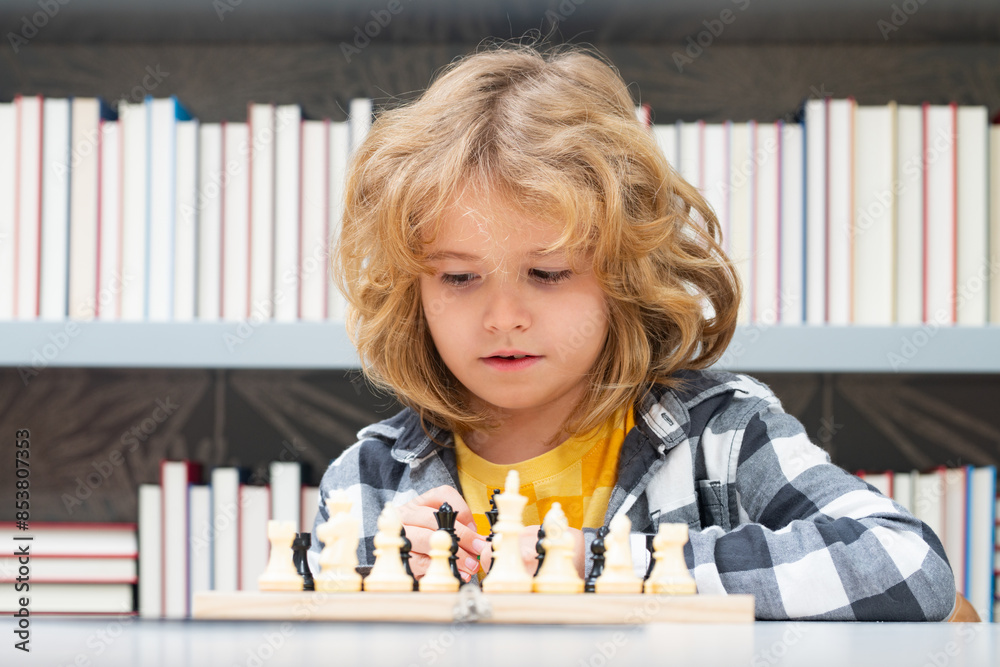 Kid play chess in classroom at school. Kid playing chess. Child ...