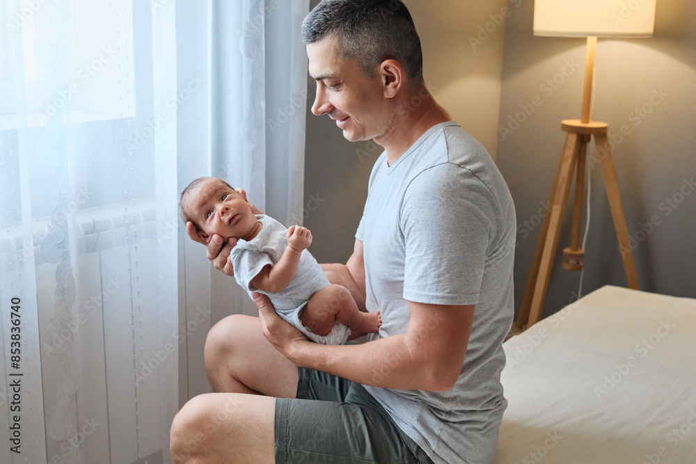 Father and newborn bonding. Tiny baby with dad. Loving family moments ...