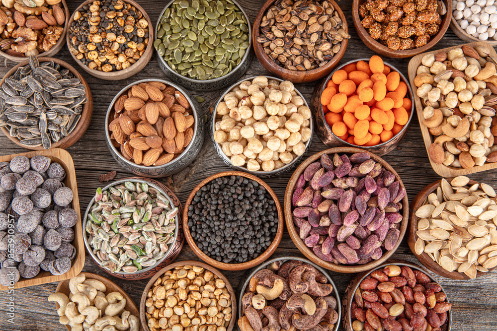 Assorted nuts and seeds background. mixed raw food for snacking, top ...