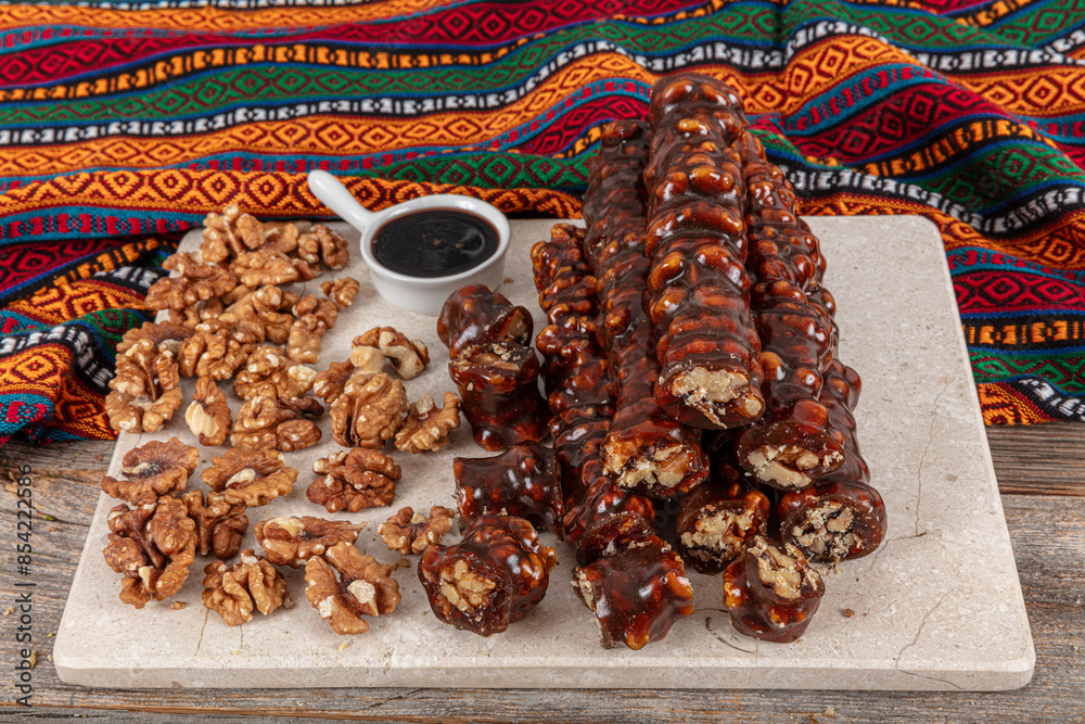 Walnut sucuk. Turkish natural dried fruit pulp with walnut sausage ...