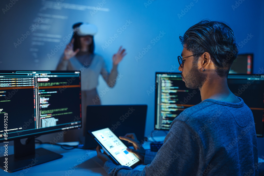 developer uses a VR headset to interact with projected interface ...