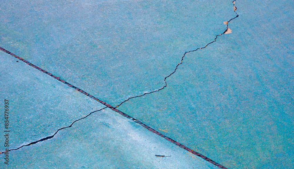 Crack lines texture on the old green washed gravel flooring surface of ...