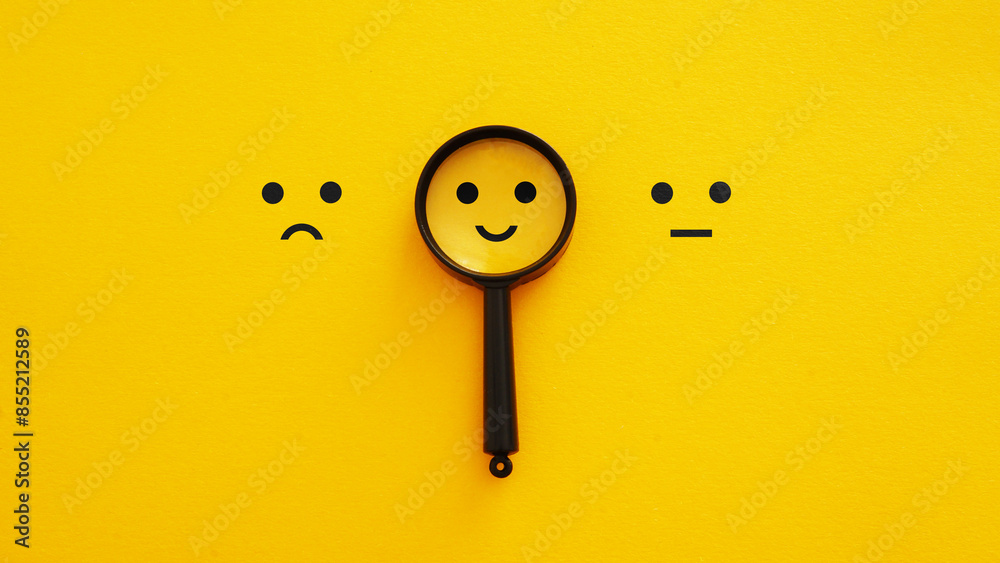 Smile happy face inside of magnifying glass between sad and neutral ...