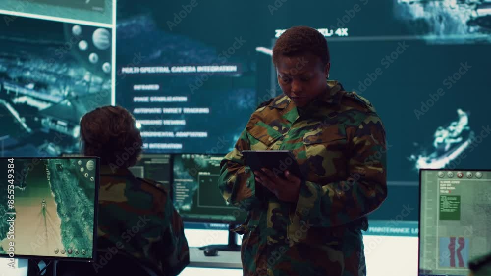 Woman sergeant major working on deployment of electronic warfare tools ...