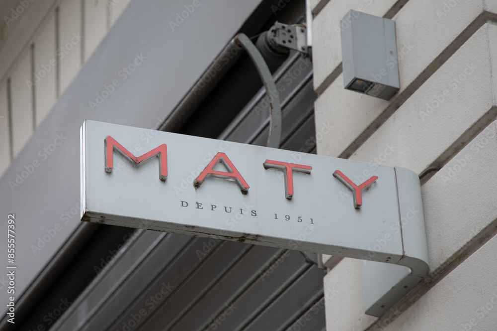 Maty brand logo and sign text on a jewelry store front in the street ...