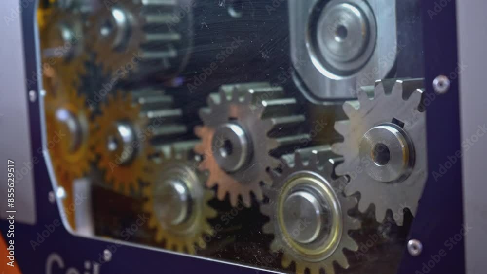 Mechanism with rotating gears. Media. Shiny metal gears rotate in ...