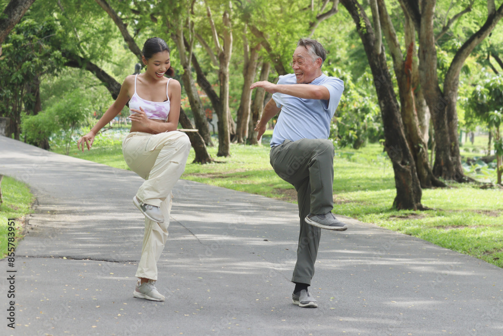 Happy elderly Asian man stretching his body before exercise with ...