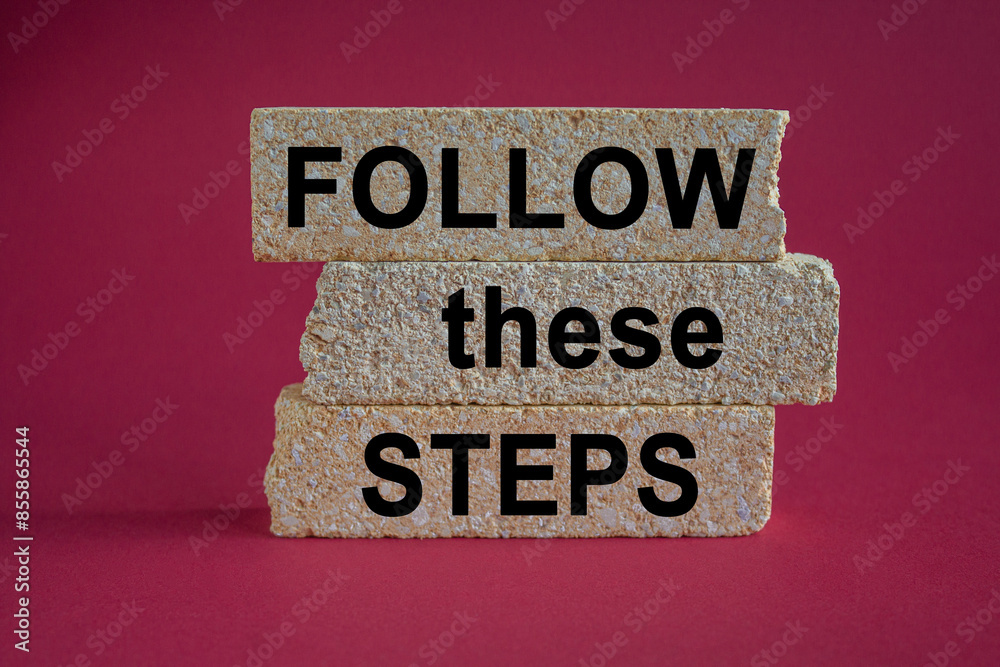 Follow these steps symbol. Concept words Follow these steps on brick ...