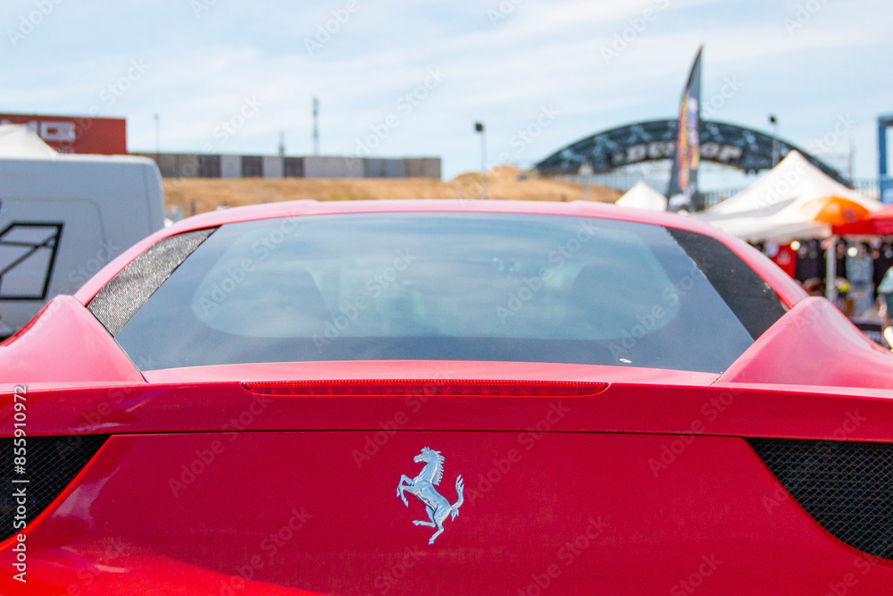 Ferrari, letters and logo with the name of this sports car on the red ...