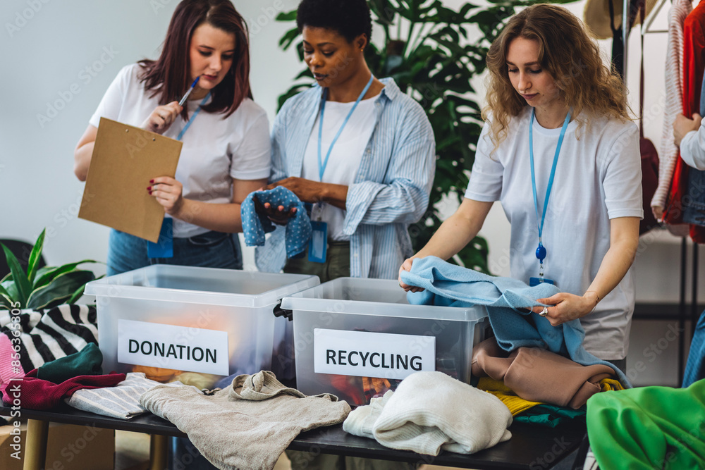 Process of sorting textile for donation, charity, recycling. Young ...