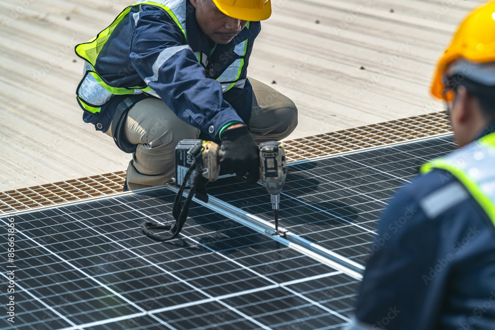 Worker Technicians are working to construct solar panels system on roof ...