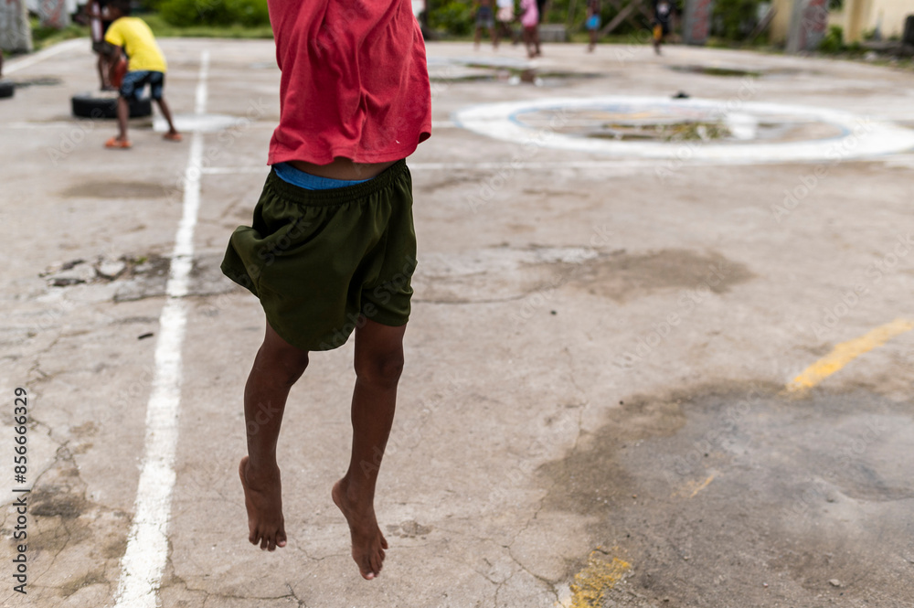 Filipino child jumping on outdoor basketball court, Philippines, Asia ...