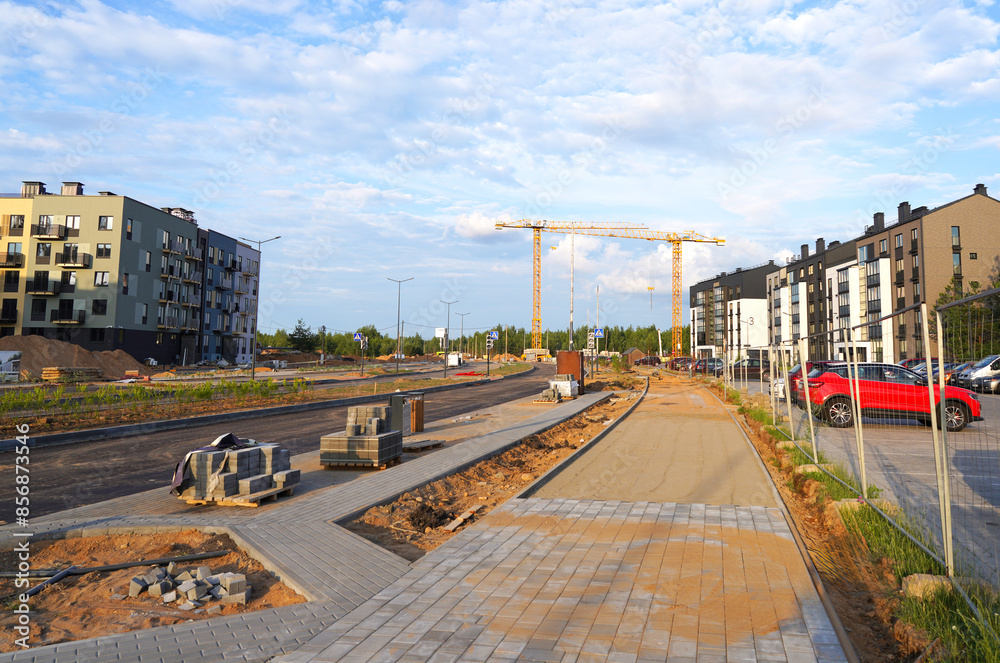 Sidewalk Tiles Laying. Laying Paving Slabs on construction site. Stone ...