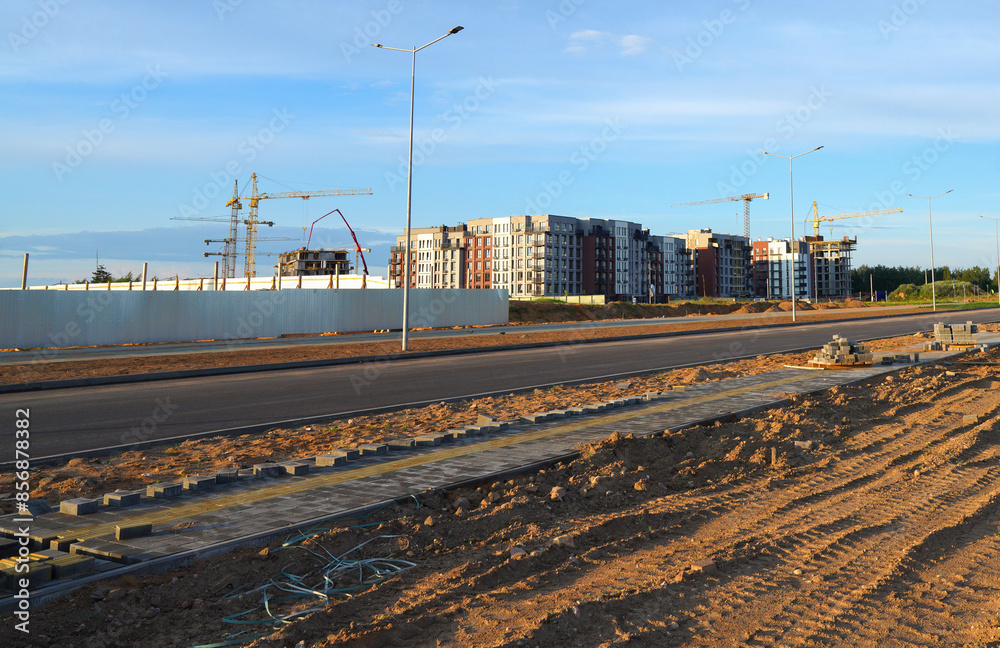 Sidewalk Tiles Laying. Laying Paving Slabs on construction site. Stone ...