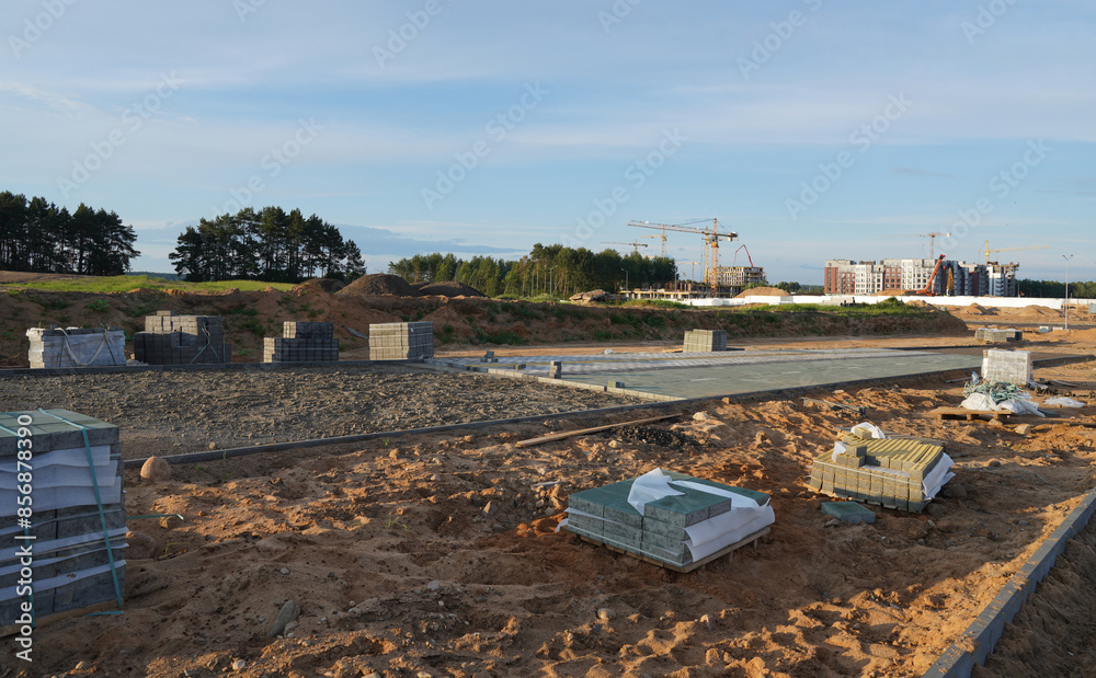 Sidewalk Tiles Laying. Laying Paving Slabs on construction site. Stone ...