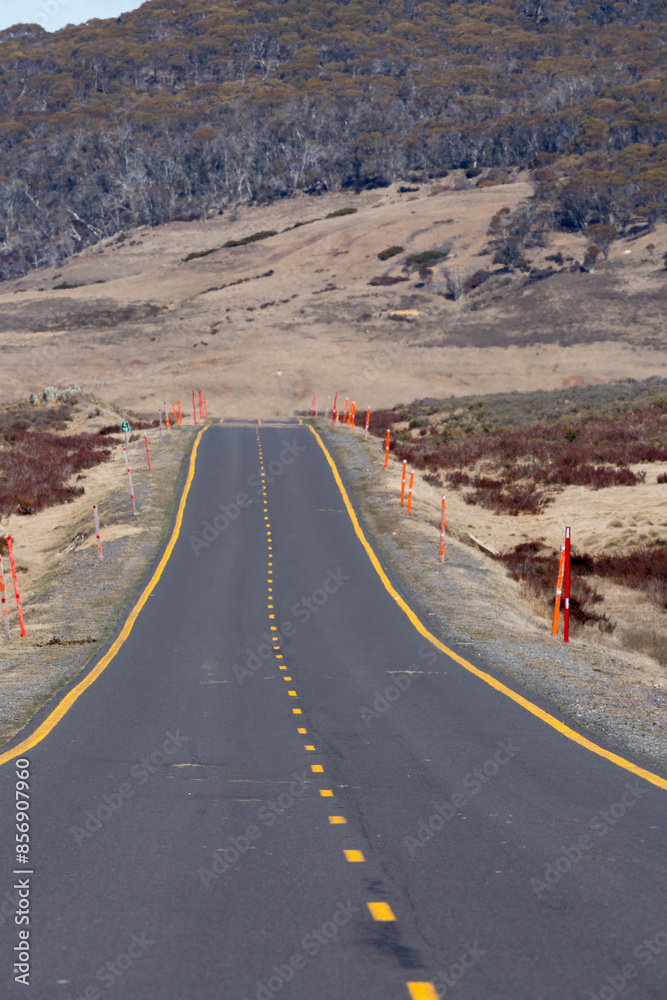 Snowy Mountains Highway, an alpine road with yellow road markings and ...
