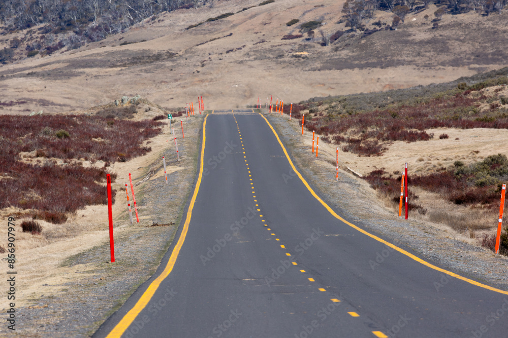 Snowy Mountains Highway, an alpine road with yellow road markings and ...