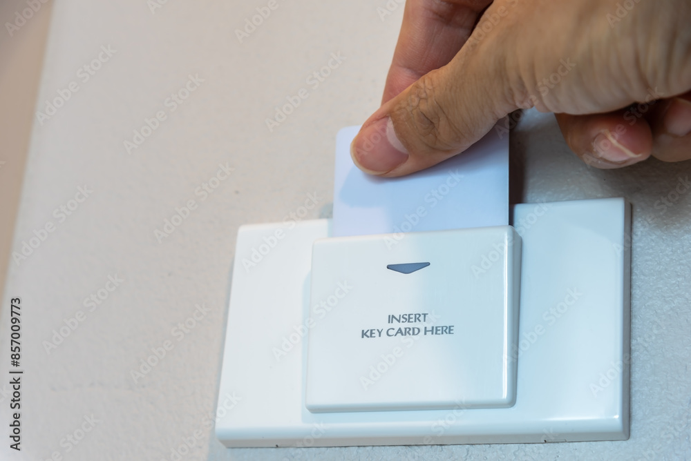 Hand inserting a key card in electronic lock at hotel room. Stock Photo ...