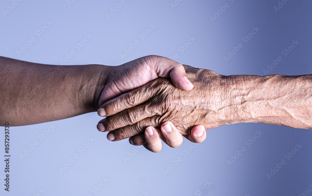 Love in different Generation, Two hands shaking, one of which is ...