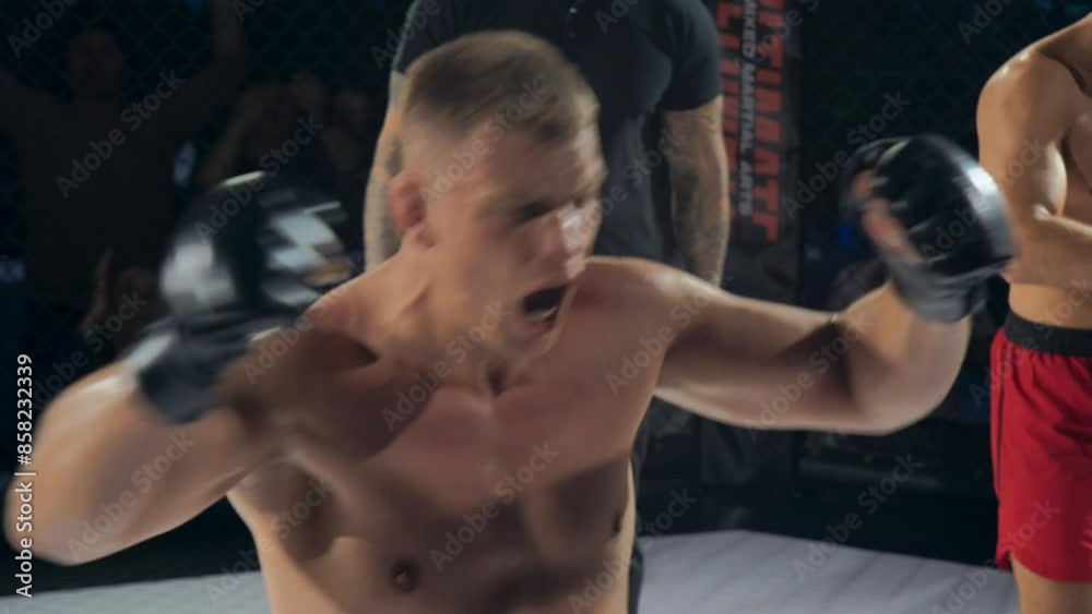 Referee Announcing the Winner Between Two Male Mixed Martial Artists ...