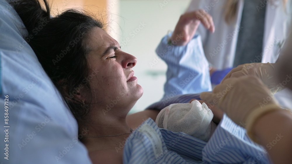 Mother trempling with pain right after giving birth to newborn baby ...