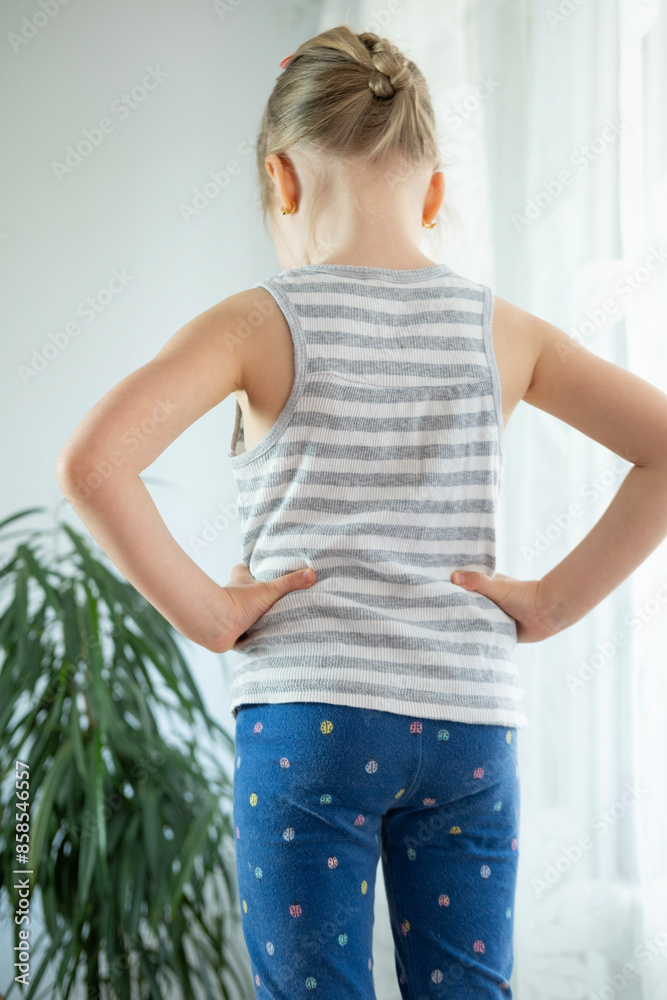 five-year-old child, young girl stands with back straight, showcasing ...