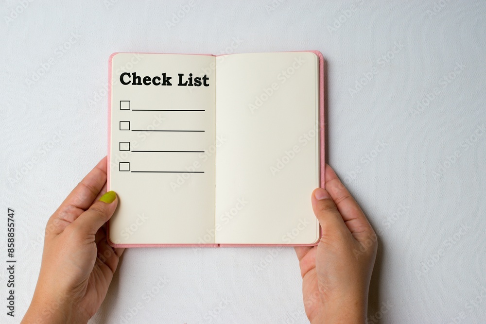 Check List Text with lines and check boxes . Hand holding diary with ...