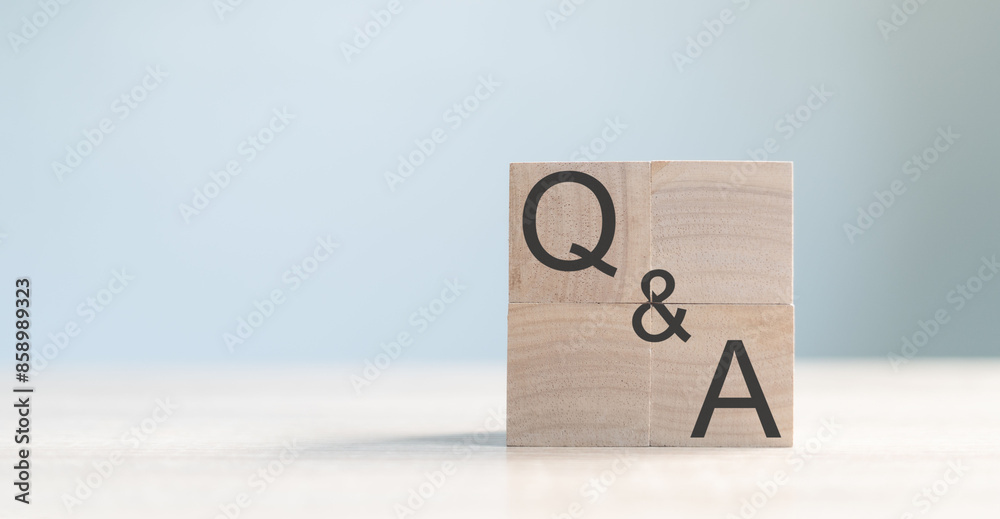 Holding hands of Q and A with wooden blocks. Answers, questions ...