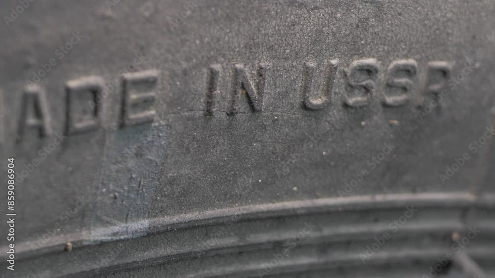 State quality mark of USSR on wheel rubber tire of truck. Made in USSR ...