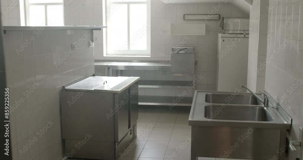 An empty restaurant kitchen enveloped in mystery. Silence is eerie and ...