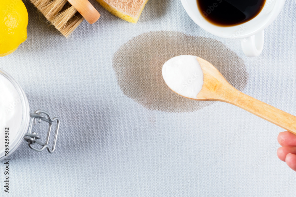 The step of sprinkling the brown stains with soda on a blue cloth ...