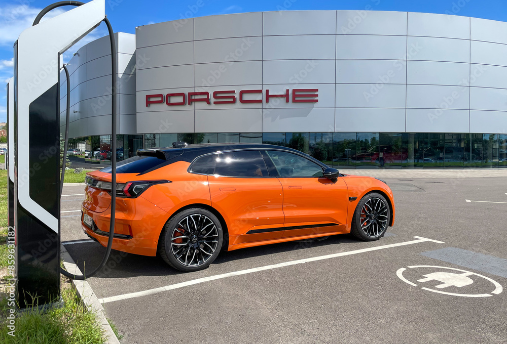Orange Zeekr 001 is parked at the charging point of electric vehicles ...