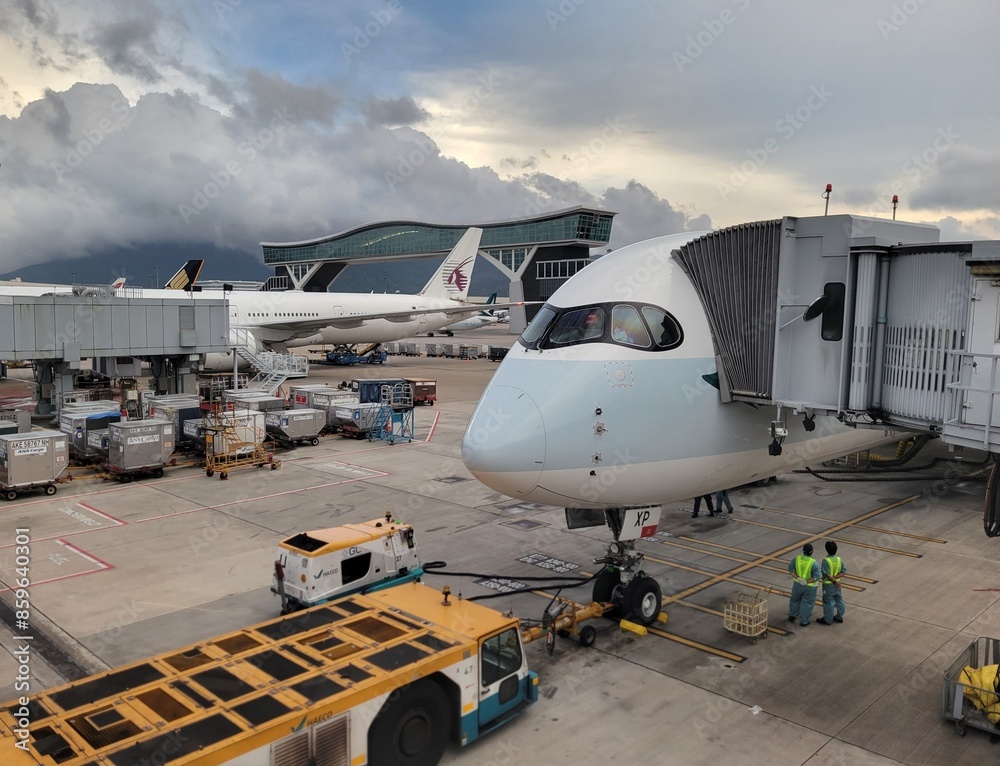 A Cathay Pacific Airbus A350 and a Qatar Airways Boeing 777-300ER ...