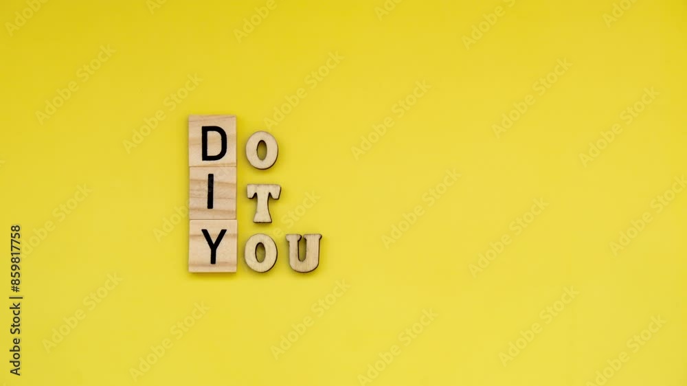 Stop motion animation DIY Do It Yourself inscription on yellow ...