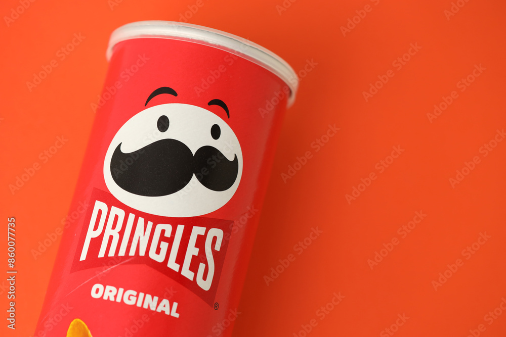 KYIV, UKRAINE - APRIL 20, 2024 Pringles original potato chips on red ...