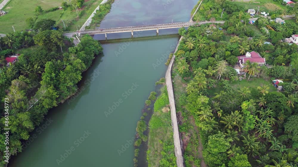 Pajo River With Calm Waters Along The Farmland, Houses And Green ...