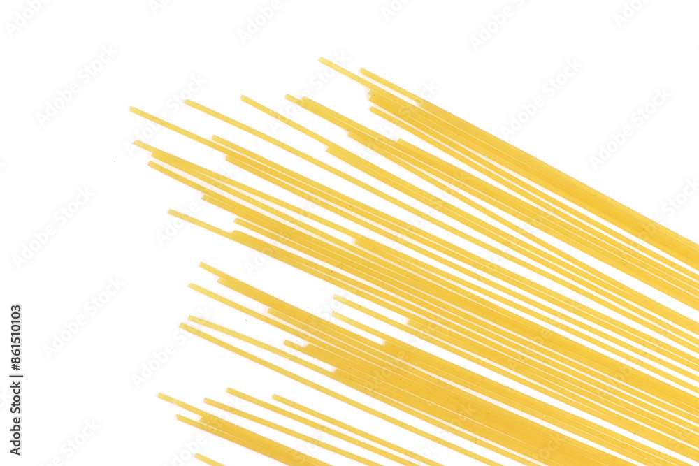 Yellow long spaghetti on White background. Thin pasta arranged in rows ...