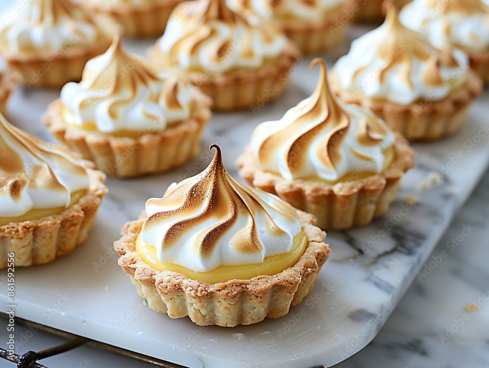 Flaky, buttery tarts filled with tangy lemon curd and topped with ...