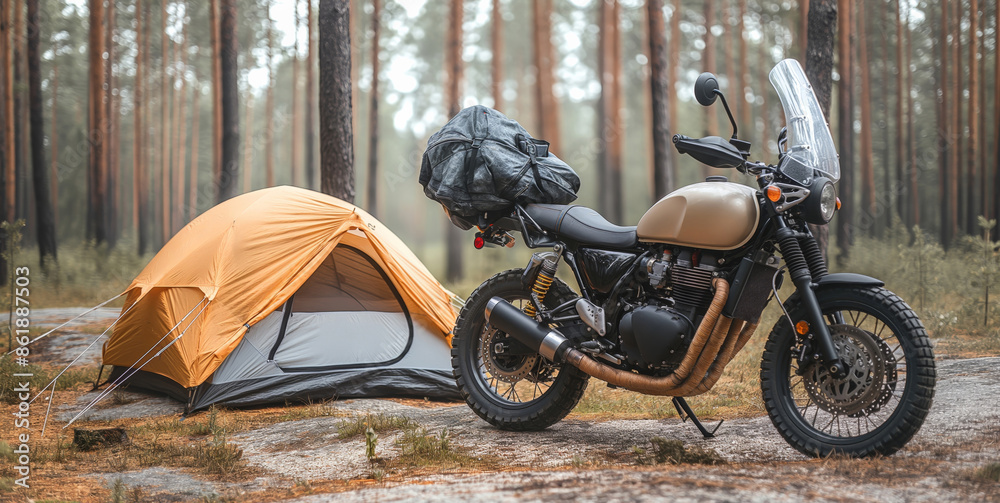 A heavily loaded motorcycle parked beside a well-pitched tent in a ...